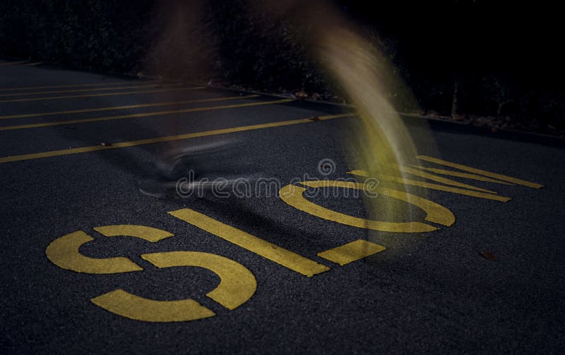 Fast Running Over Slow Sign on Pavement Stock Photo - Image of road ...