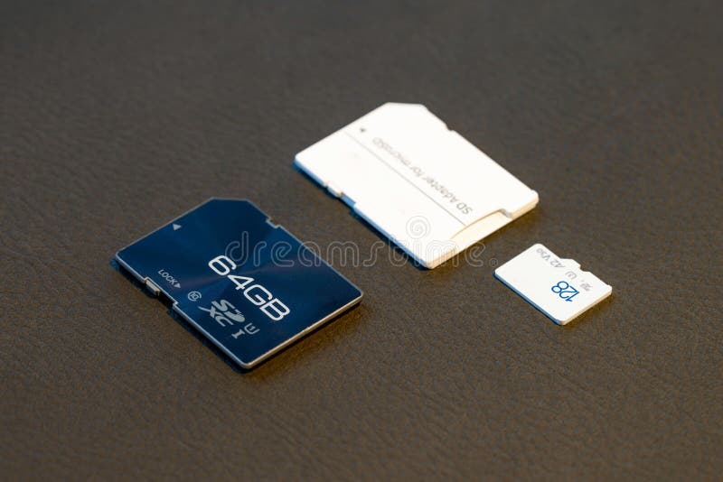 Fast SD Memory Card and Micro SD Card with Adapter on Grey Textured ...