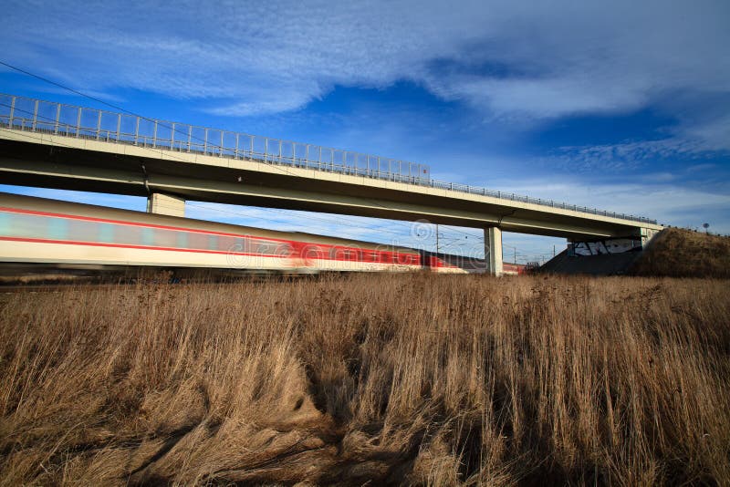 Fast Train Passing Under a Bridge on a Lovely Summer Day Stock Image ...