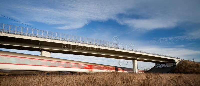Fast Train Passing Under a Bridge on a Lovely Summer Day Stock Image ...