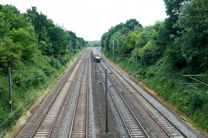 Fast Train Travelling on the Tracks, Passenger Train Stock Image ...