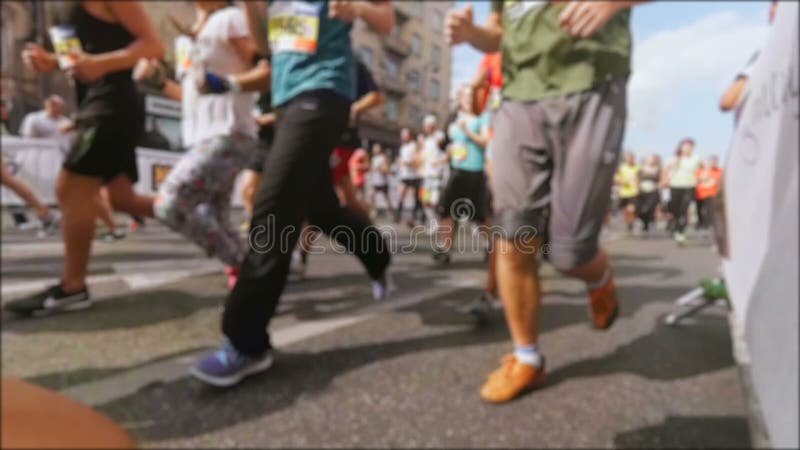 Fast Video of Big Crowd of Runners Running Past the Camera Stock ...