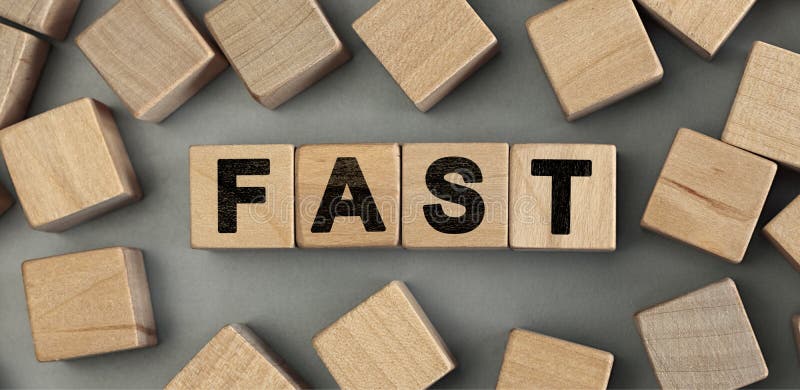 FAST - Word Concept from Wooden Blocks. Top View Stock Photo - Image of ...