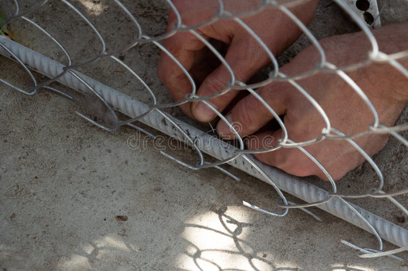Fastening the Bottom of the Fence Made of Galvanized Rectangular Mesh ...