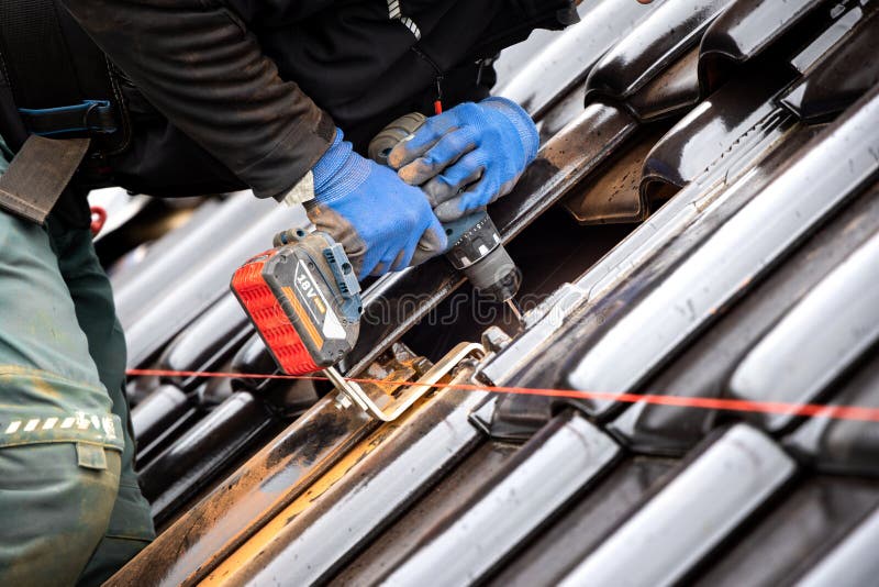 Fastening a Bracket To the Roof for a Solar Panel Mounting System Stock ...