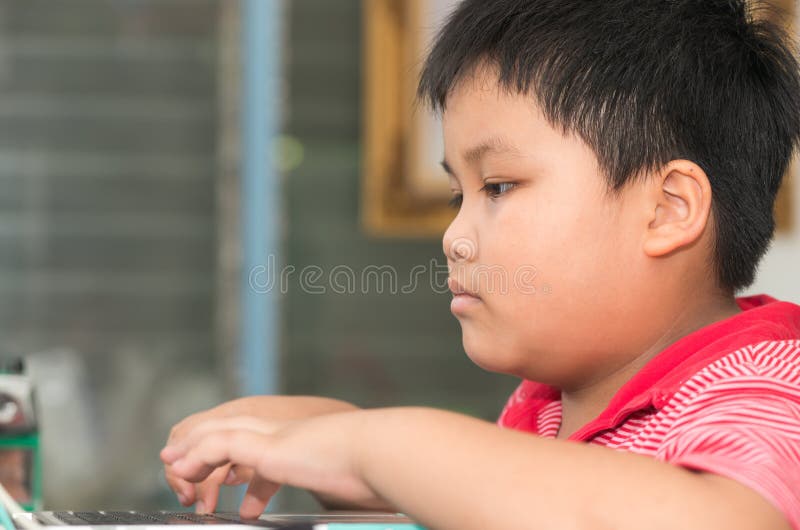 Fat Boy Use Notebook To Doing His Homework Stock Photo - Image of ...