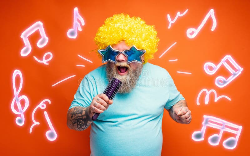 Fat Man with Beard, Tattoos and Sunglasses Sings a Song Stock Photo ...