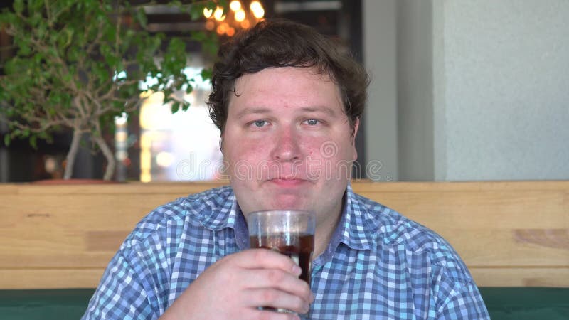 Fat Man in the Cafe or Restaurant Drinking Cola Stock Footage - Video ...