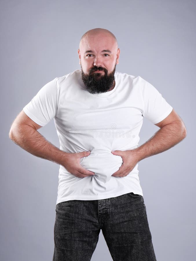 Fat man on grey background stock image. Image of grey - 127626699