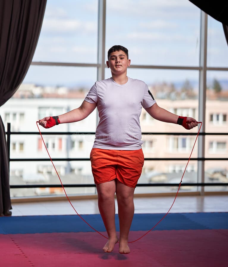 Fat Man Jumping Rope in the Gym Stock Photo - Image of club, jumping ...