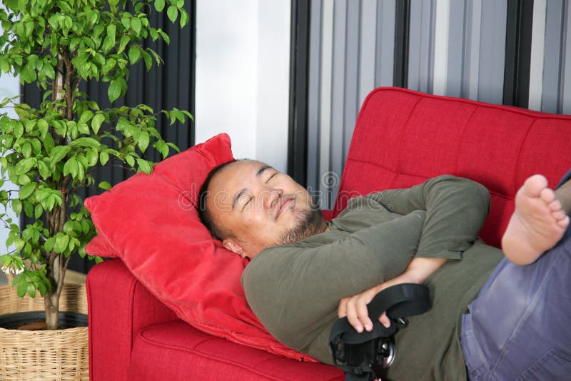 Fat man in the living room stock photo. Image of lying - 121383004