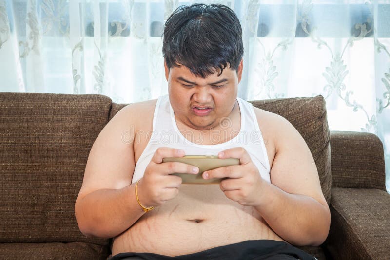 Fat Man Play Game with His Smartphone Stock Photo - Image of cell ...