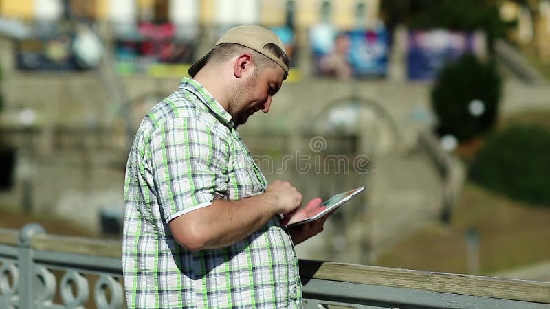 Fat Man Records Video on Tablet Computer Stock Footage - Video of ...