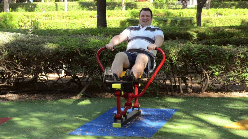 Fat Man on the Rowing Machine Stock Video Footage - Video of limbs ...