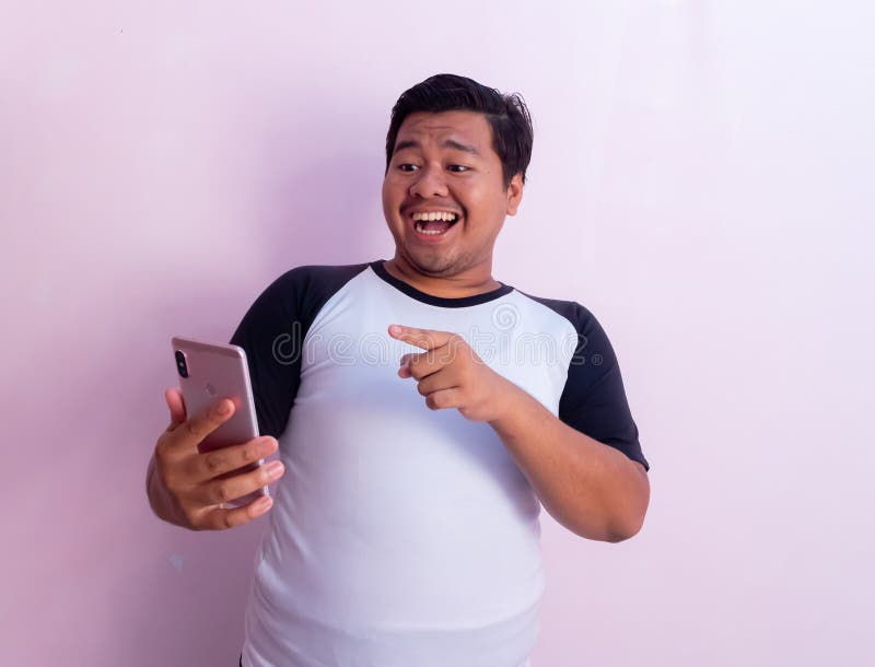 FAT MAN SEE a HANDPHONE with EXCITED EXPRESSION Stock Photo - Image of ...
