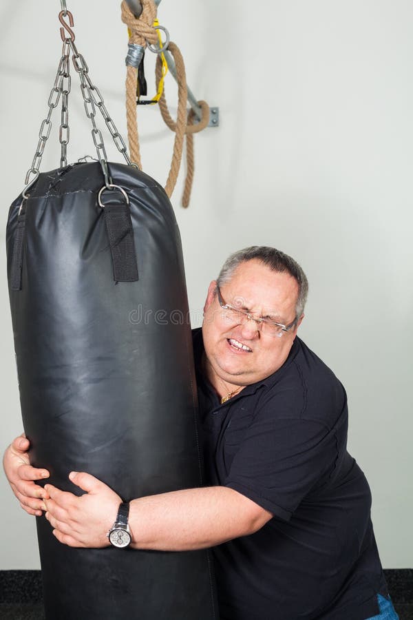 Fat Man Struggling with a Punching Bag Stock Photo - Image of heavy ...