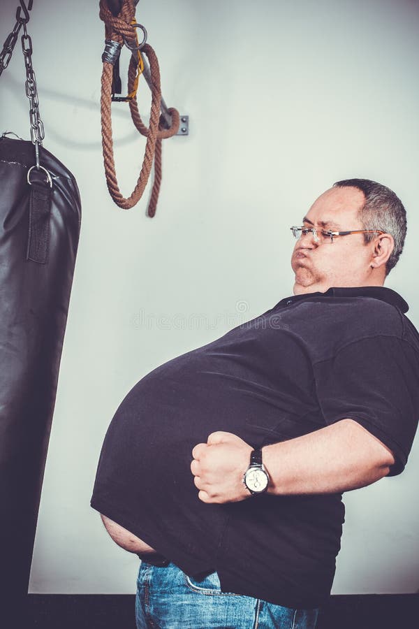 Fat man trains box in gym stock photo. Image of background - 93617664
