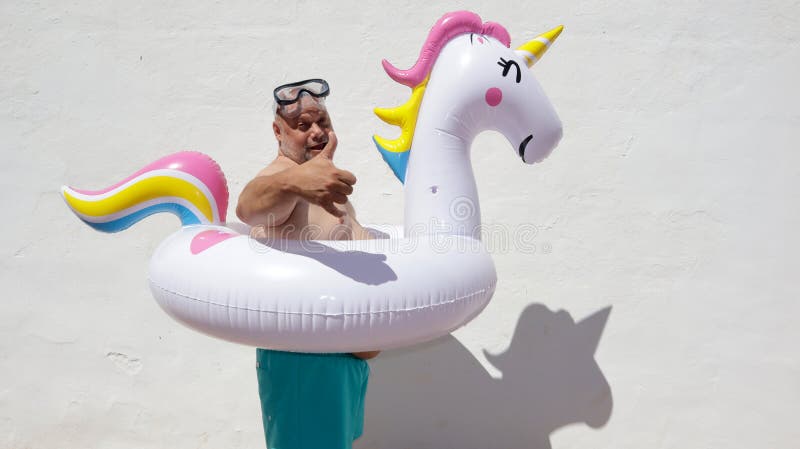 Fat Ridiculous Man with an Unicorn Float Stock Photo - Image of summer ...