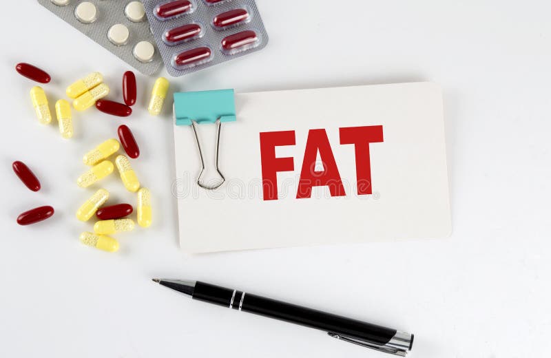 FAT Text Written in a Card with Pills. Medical Concept Stock Photo ...
