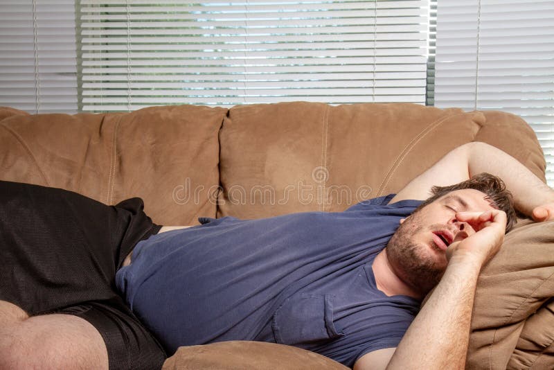 Fat Tired Man Passed Out on the Couch Stock Image - Image of inside ...