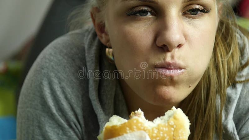Fat Woman Holding Fast Food Burger And Chewing It Eating Junk Food