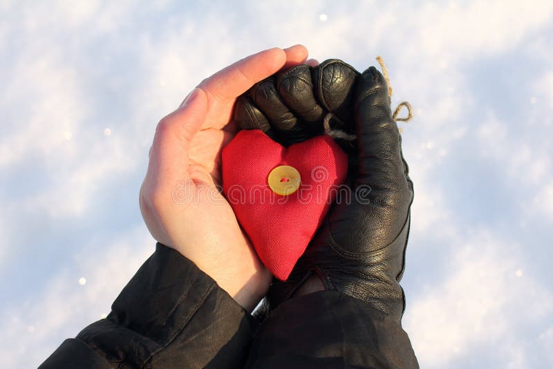 The Fate of the Heart in the Hands Stock Photo - Image of sign, design ...