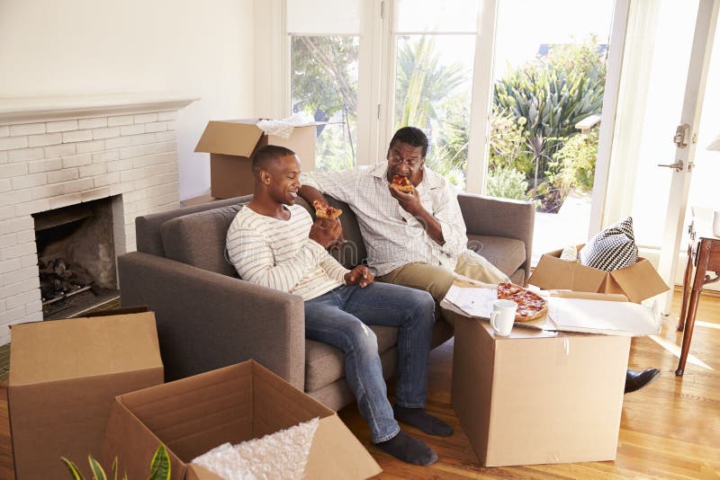 Father and Adult Son Take a Break with Pizza on Moving Day Stock Image ...