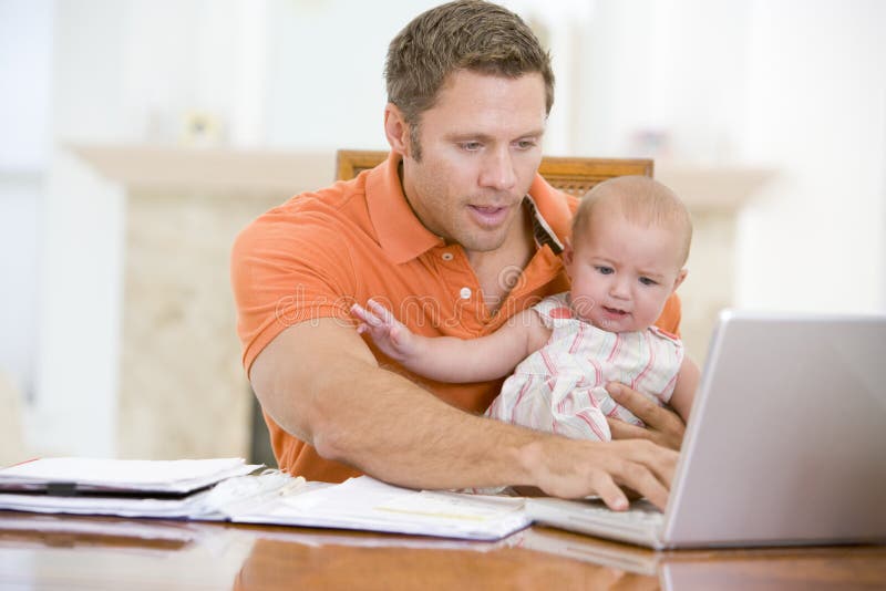 Father and Baby in Dining Room with Laptop Stock Photo - Image of ...