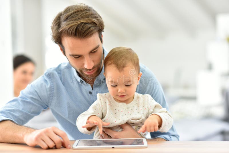 Father and Baby Playing on Tablet Stock Image - Image of happy, smile ...