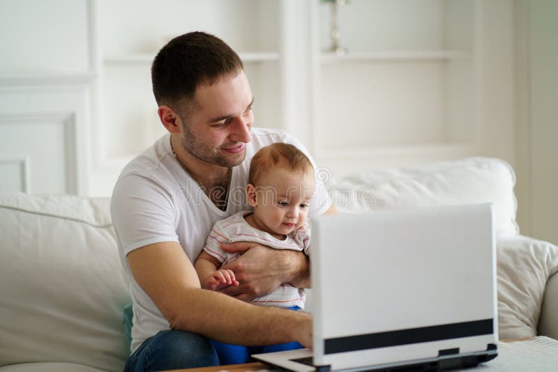 Father Babysitting and Working on Computer Stock Image - Image of ...