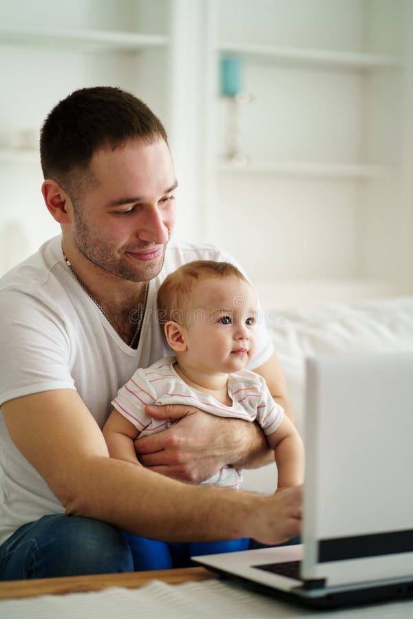 Father Babysitting And Working On Computer Stock Image - Image of home ...