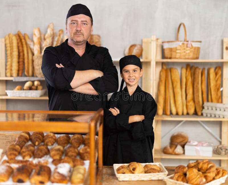 Father Baker Poses with His Daughter in Black Chef Uniform Stock Image ...