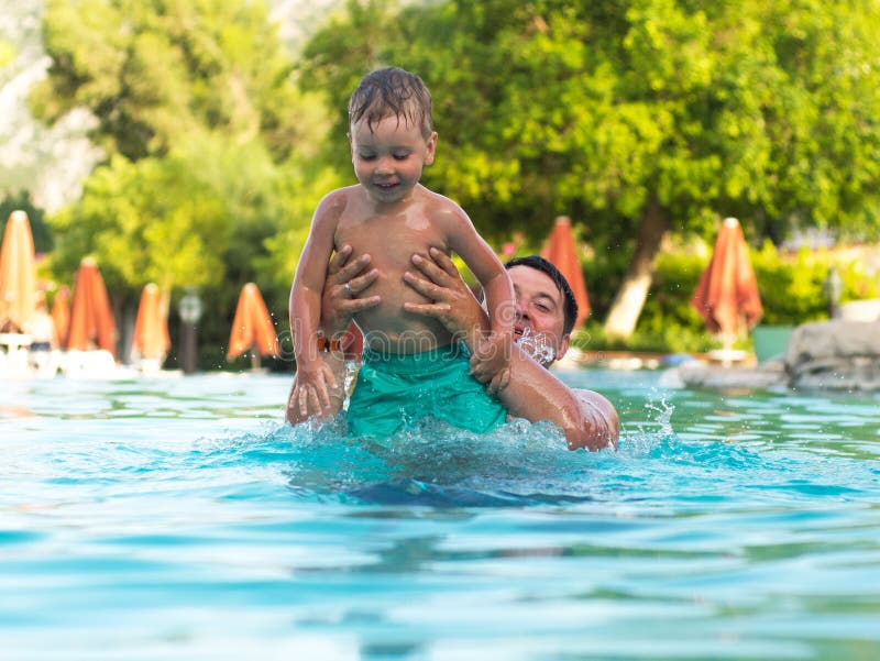 Father and Child Swimming in the Pool Stock Image - Image of healthy ...