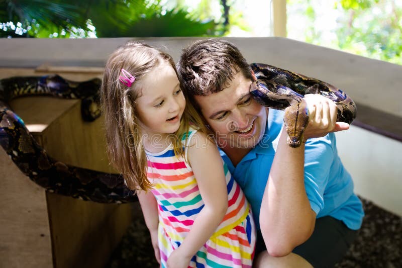 Kids Hold Python Snake at Zoo. Child and Reptile Stock Photo - Image of ...