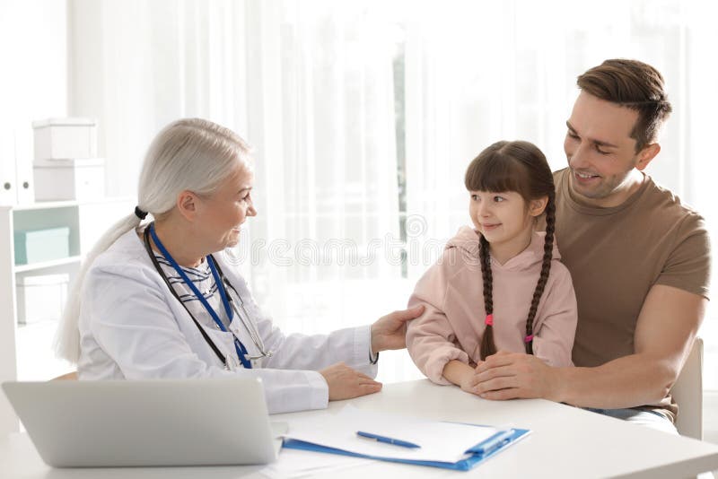 Father with Child Visiting Doctor Stock Photo - Image of clinician ...