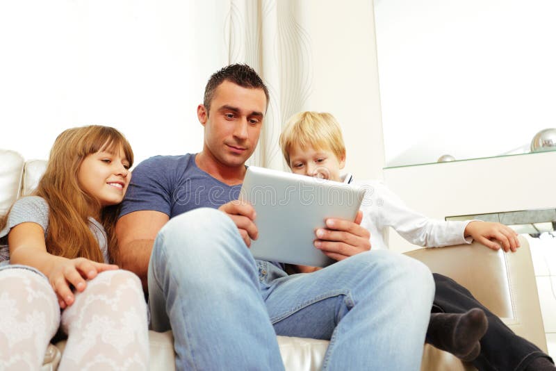 Father with Children Playing on Tablet Computer Stock Image - Image of ...