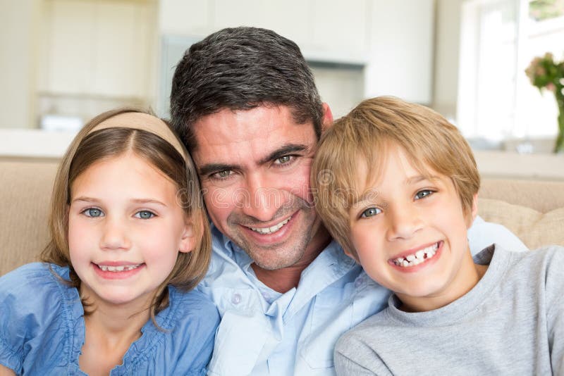 Father and Children Smiling at Home Stock Image - Image of adult ...