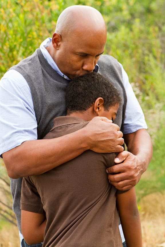 Father comforting his son. stock photo. Image of adult - 99647320