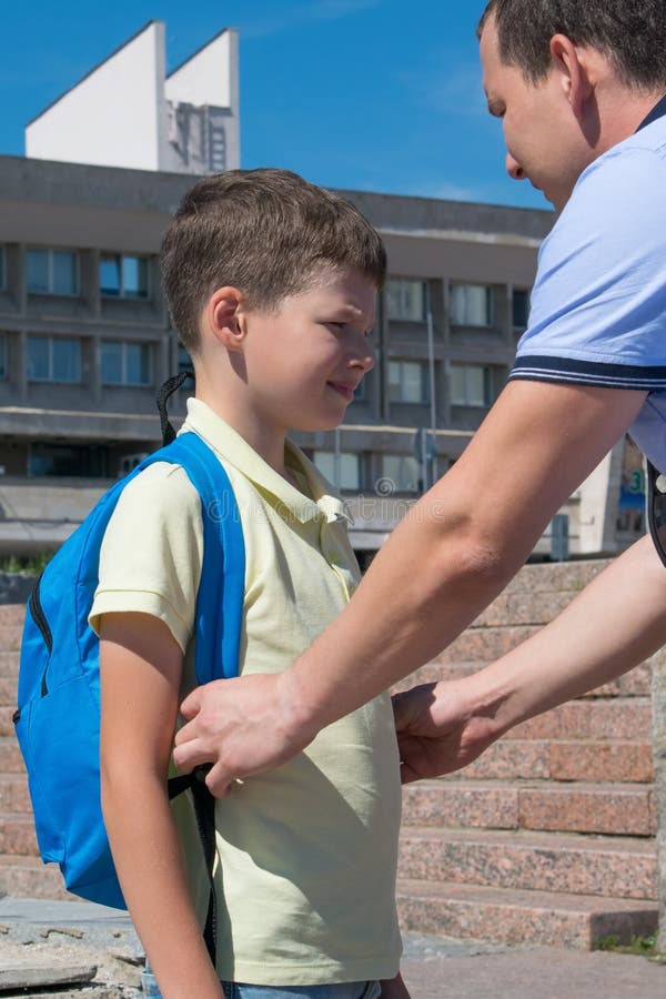 Father Corrects His Son a School Backpack Stock Image - Image of ...