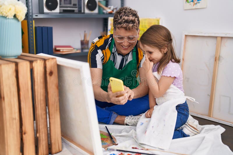 Father and Daughter Artists Using Smartphone Drawing at Art Studio ...