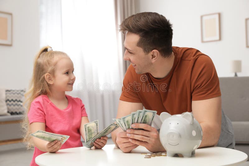 Father and Daughter Counting Money at Table Stock Photo - Image of ...