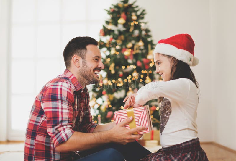 Father and Daughter Exchanging and Opening Christmas Presents Stock ...