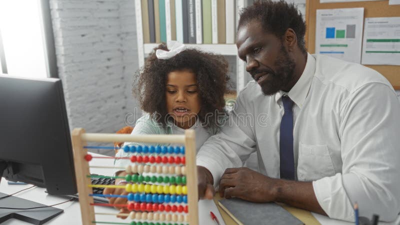 Father and Daughter Explore Learning with an Abacus in an Office ...