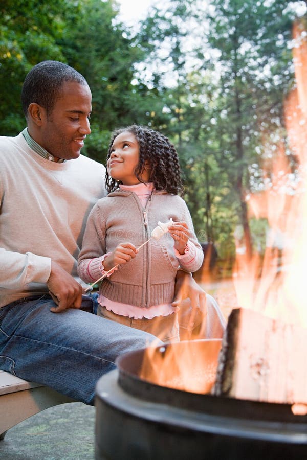 Father and Daughter by Fire Stock Photo - Image of enjoy, adorable ...