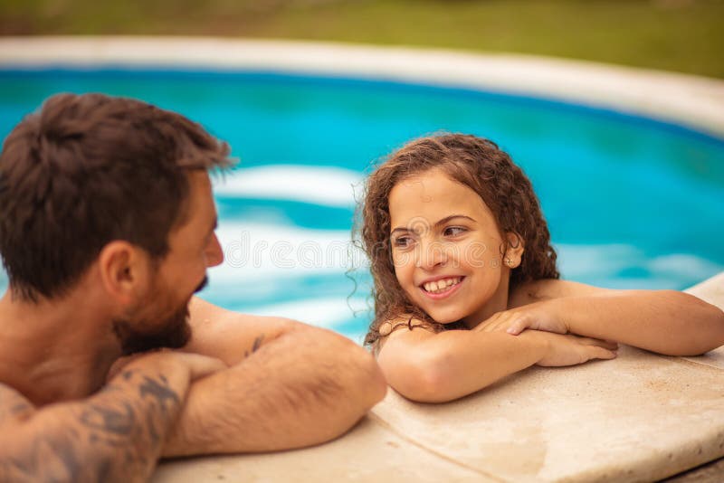 Father and Daughter Having Talk in Swimming Pool Stock Image - Image of ...