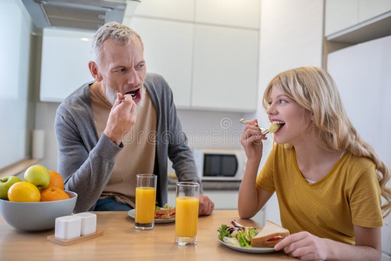 A Father and a Daughter in the Kitchen Having Breakfast Stock Image ...