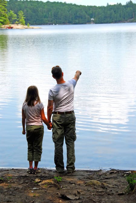 Father daughter lake stock photo. Image of hand, hold - 1274538