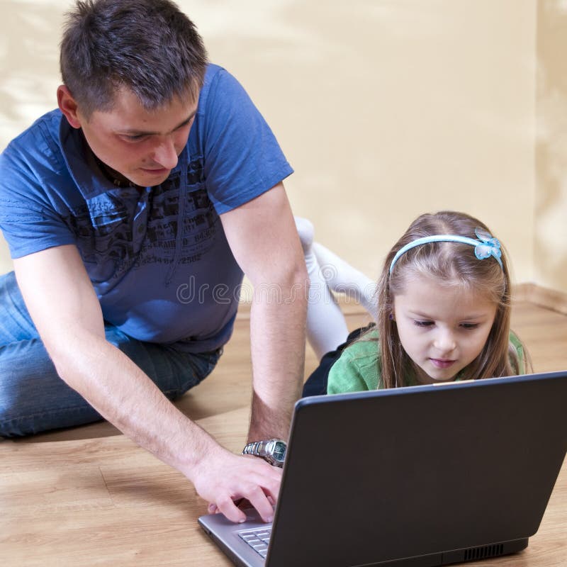 Father and Daughter Looking at Laptop Screen Stock Photo - Image of ...