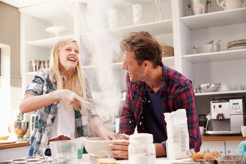 Father and Daughter Making a Cake Together Stock Photo - Image of ...