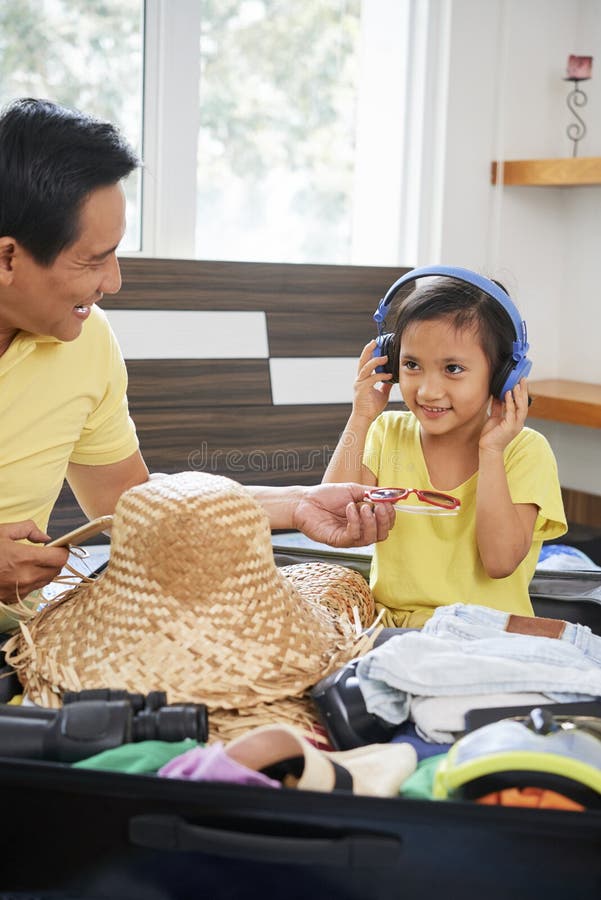 Father and Daughter Packing Suitcase Stock Image - Image of accessory ...